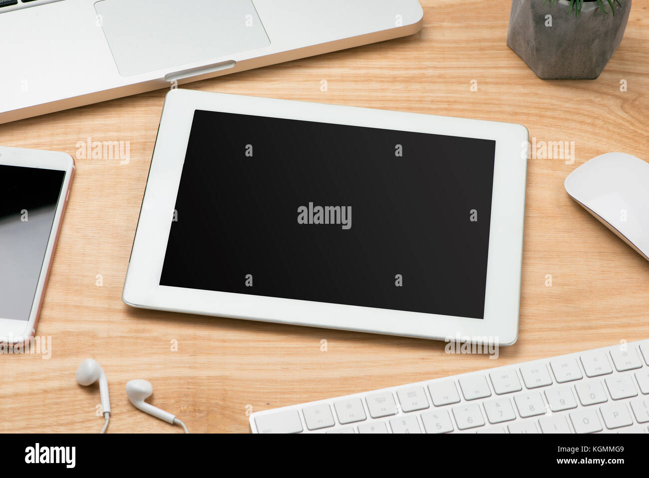 Top view of white tablet with black screen for advertising display on ...