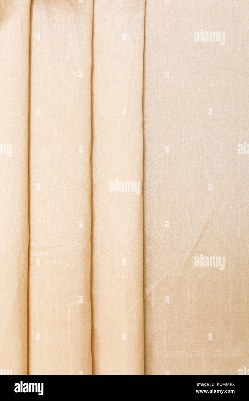 Golden wavy fabric texture / background Stock Photo - Alamy