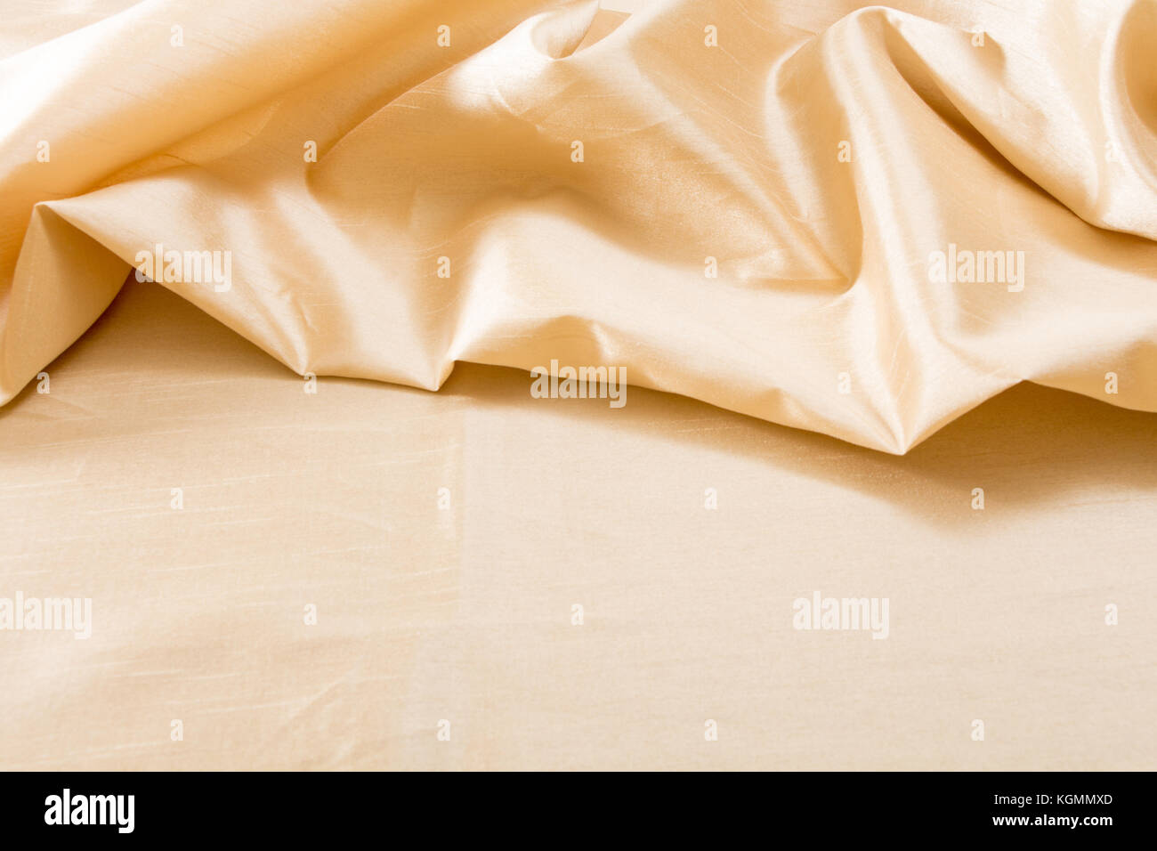 Golden wavy fabric texture / background Stock Photo - Alamy
