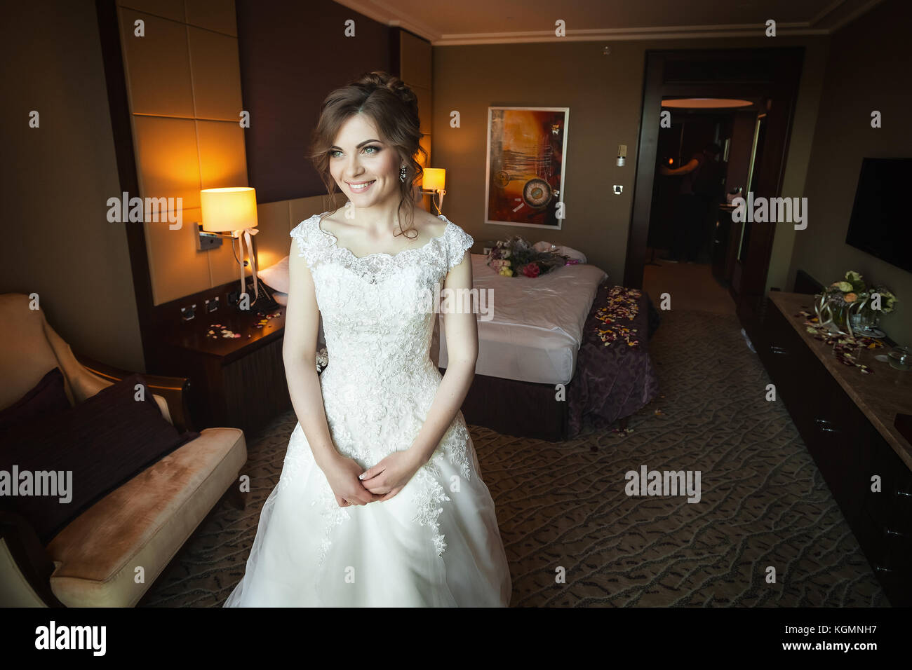 Pretty bride waiting groom in room Stock Photo - Alamy