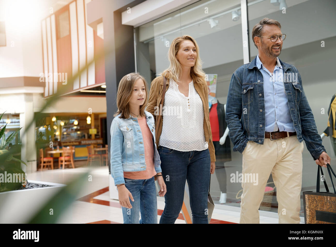 Family on shopping day walking in mall Stock Photo - Alamy