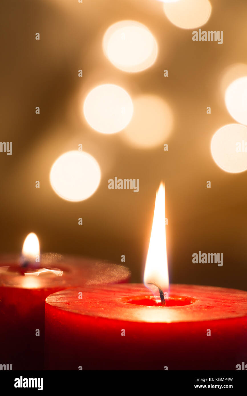 Lit red candles closeup and golden background with bokeh Stock Photo ...