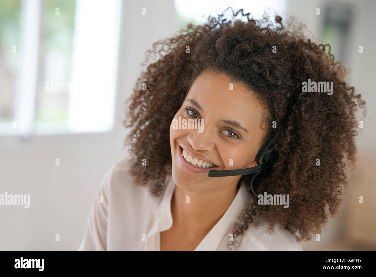 Portrait of customer service assistant talking on phone Stock Photo - Alamy