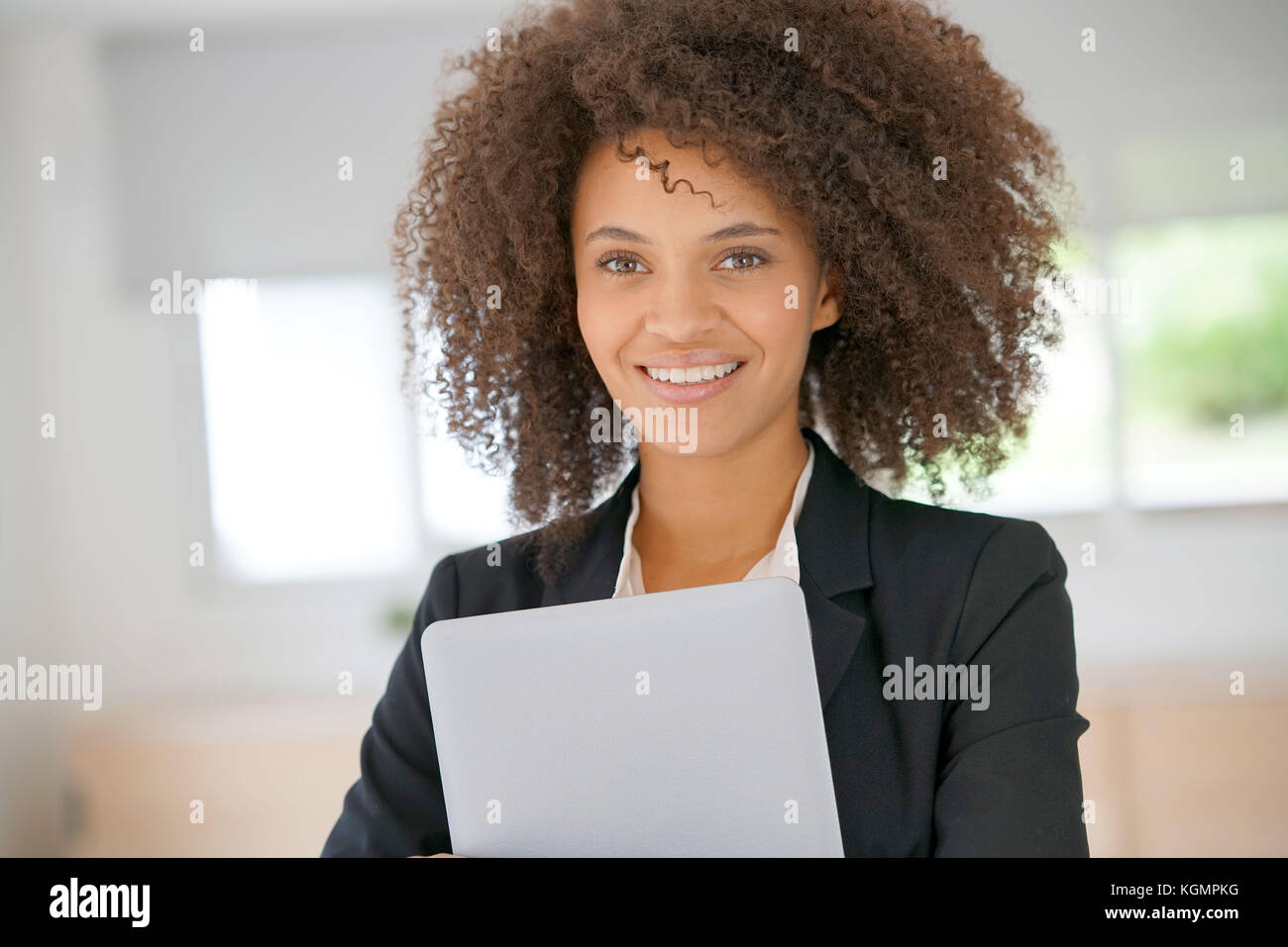 Portrait of attractive mixed-race businesswoman Stock Photo - Alamy