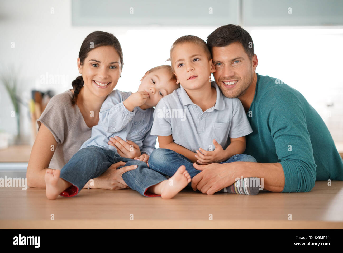 Portrait of happy family of four Stock Photo - Alamy