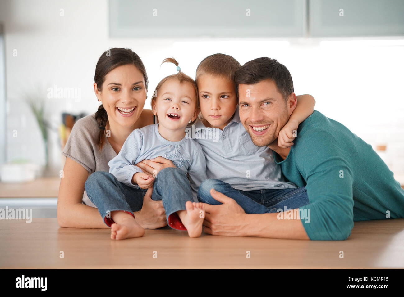 Portrait of happy family of four Stock Photo - Alamy