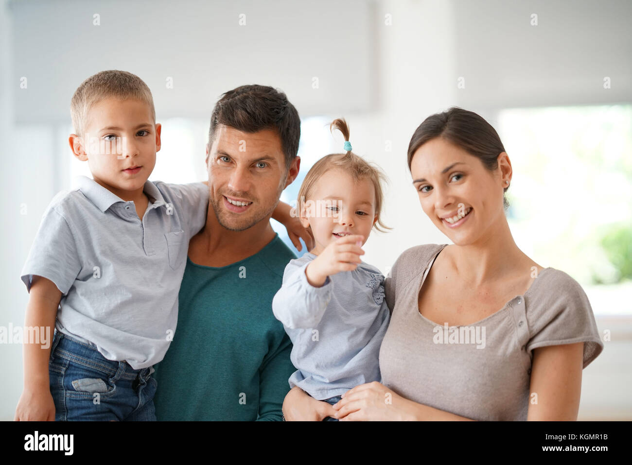 Portrait of happy family of four Stock Photo - Alamy
