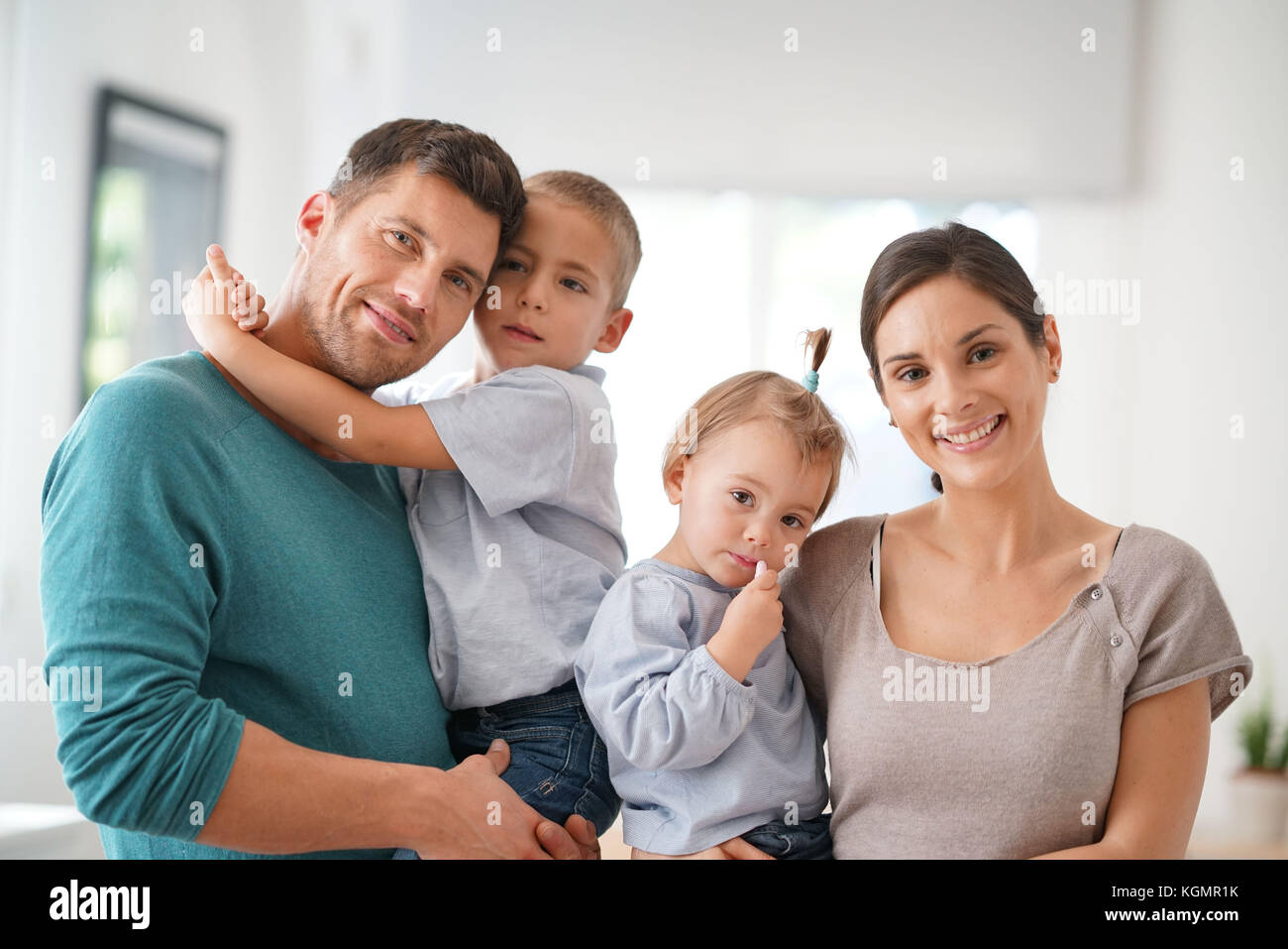 Portrait of happy family of four Stock Photo - Alamy