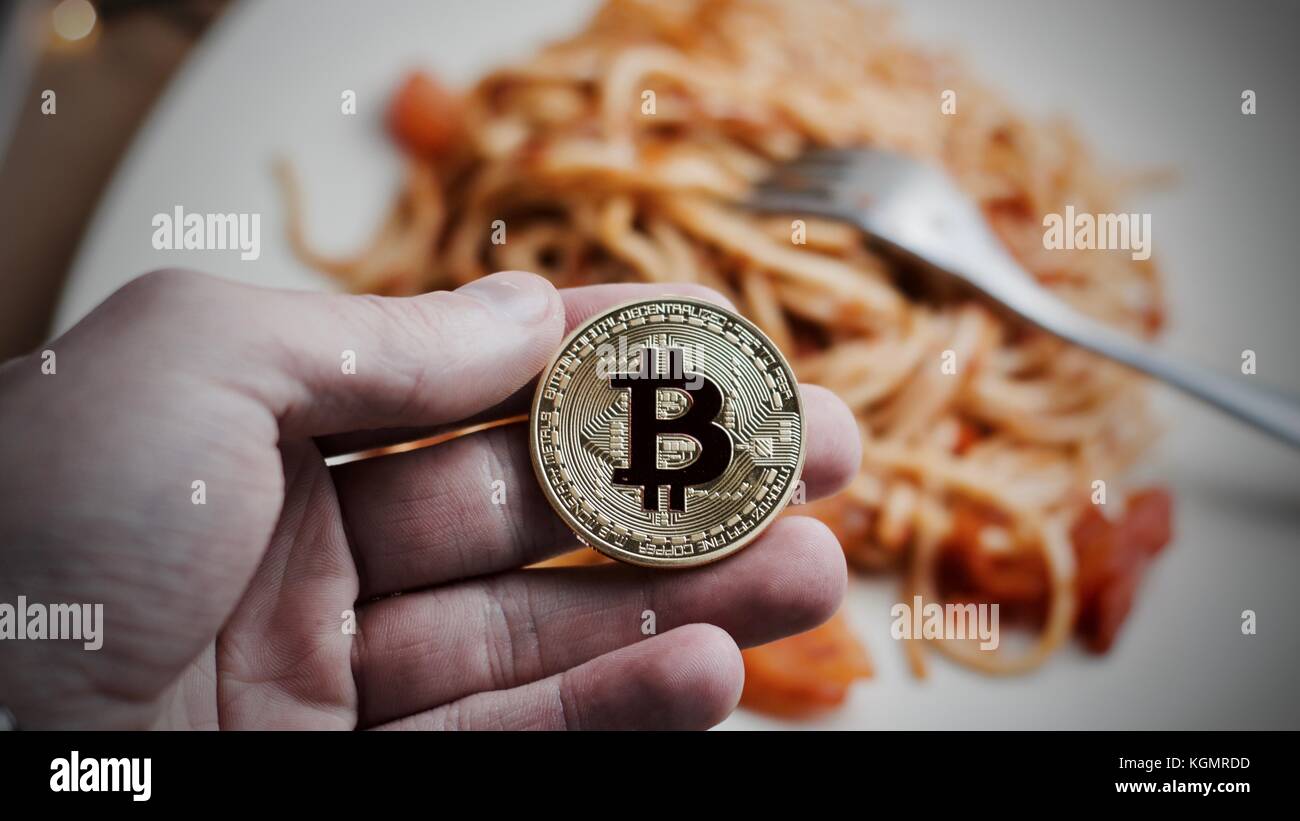 Digital currency physical metal bitcoin coin. Restaurant pasta concept ...