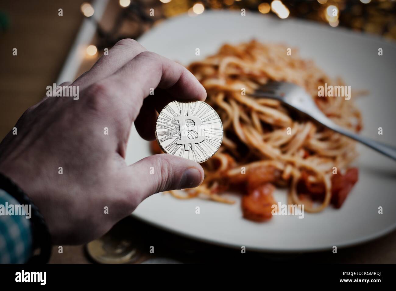 Digital currency physical metal bitcoin coin. Restaurant pasta concept ...