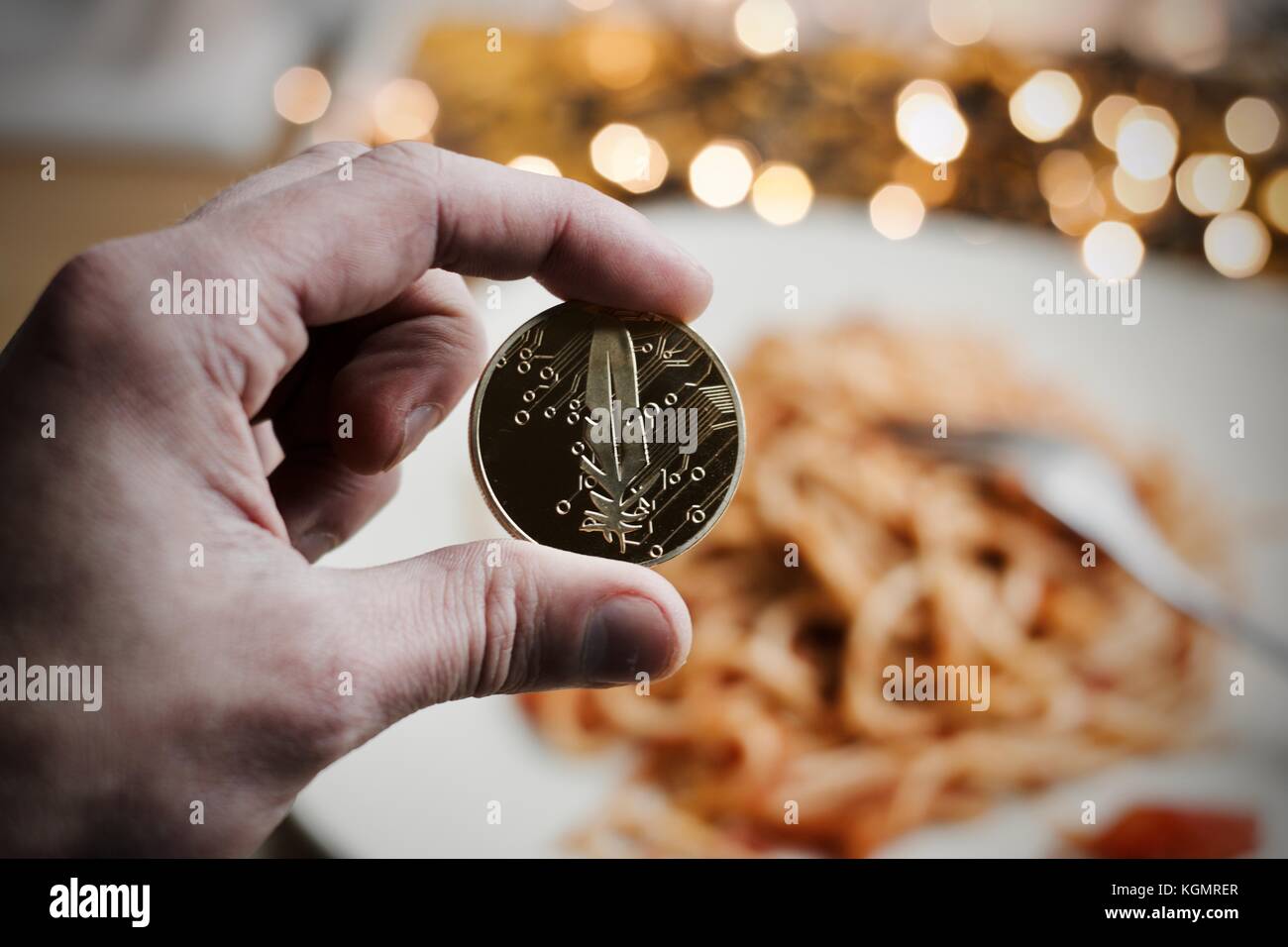 Digital currency physical gold feather coin. Italian pasta food concept ...