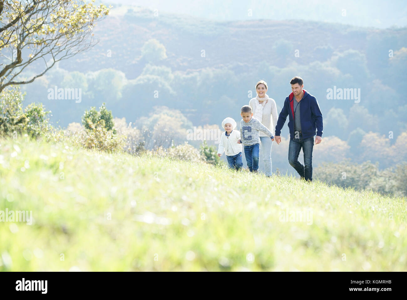 Happy family walking countryside hi-res stock photography and images ...