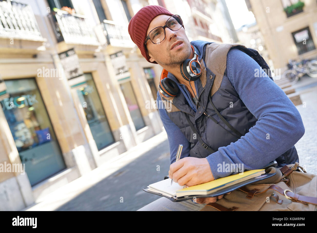 Photo reporter writing notes on photo tour Stock Photo - Alamy