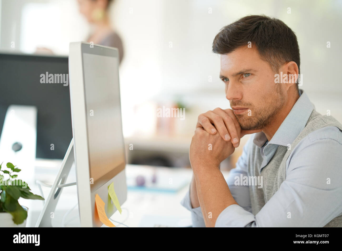 Handsome businessman working for startup company Stock Photo - Alamy