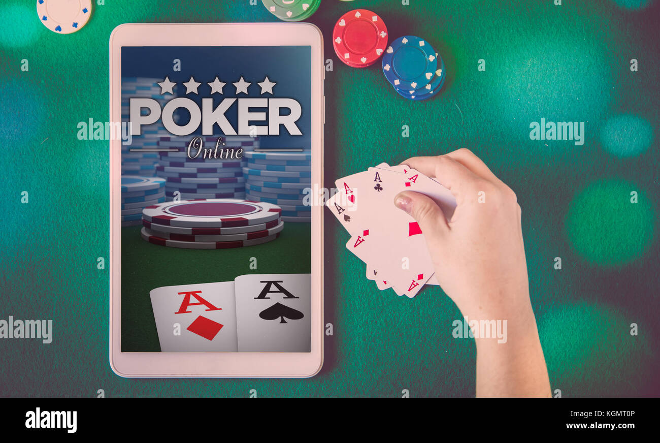 cards, chips and tablet over poker table Stock Photo - Alamy