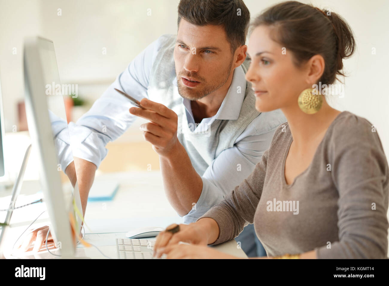 Startup business partners working together in desktop Stock Photo - Alamy