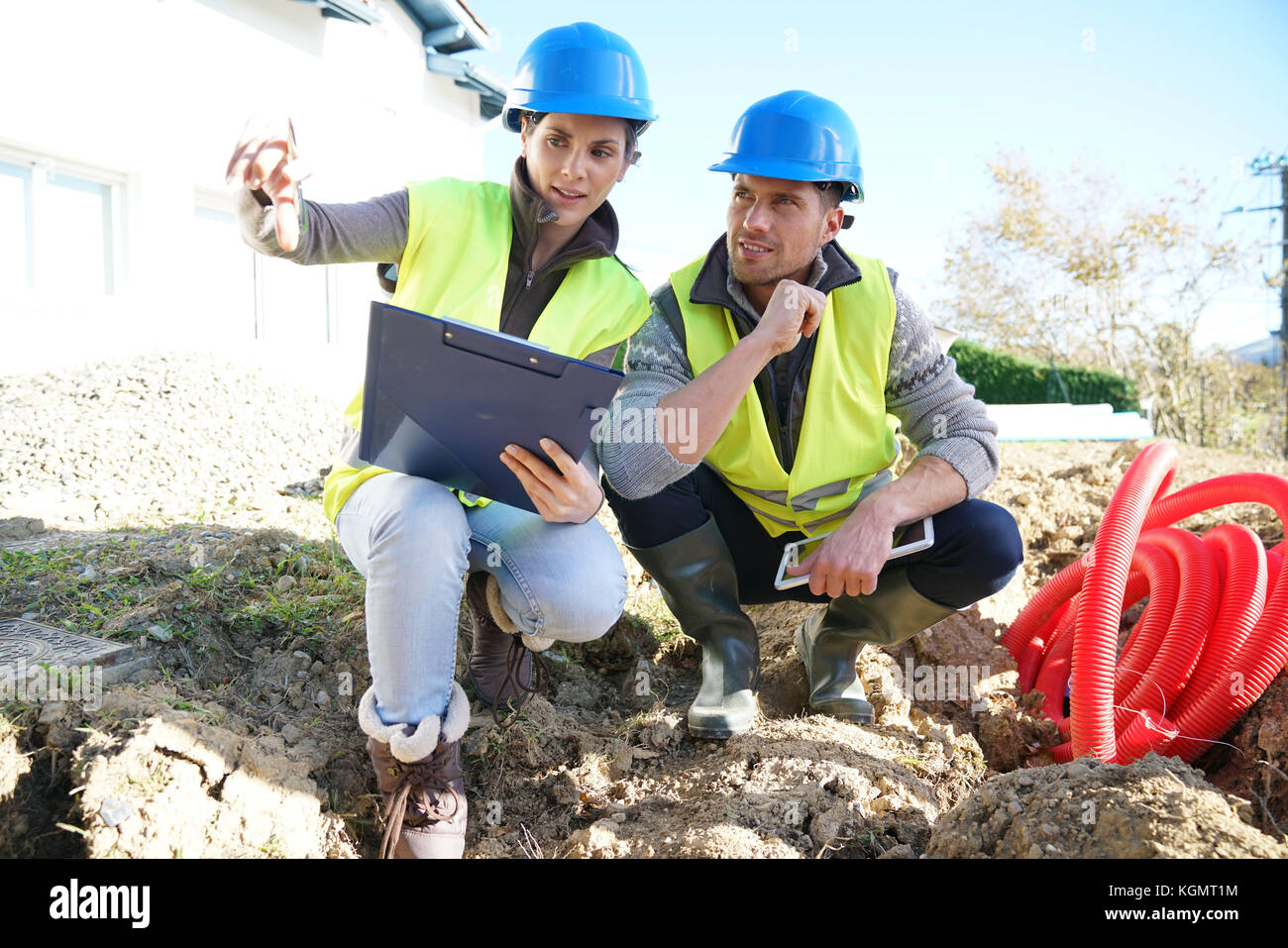 Construction site professional looking at digging in work Stock Photo ...