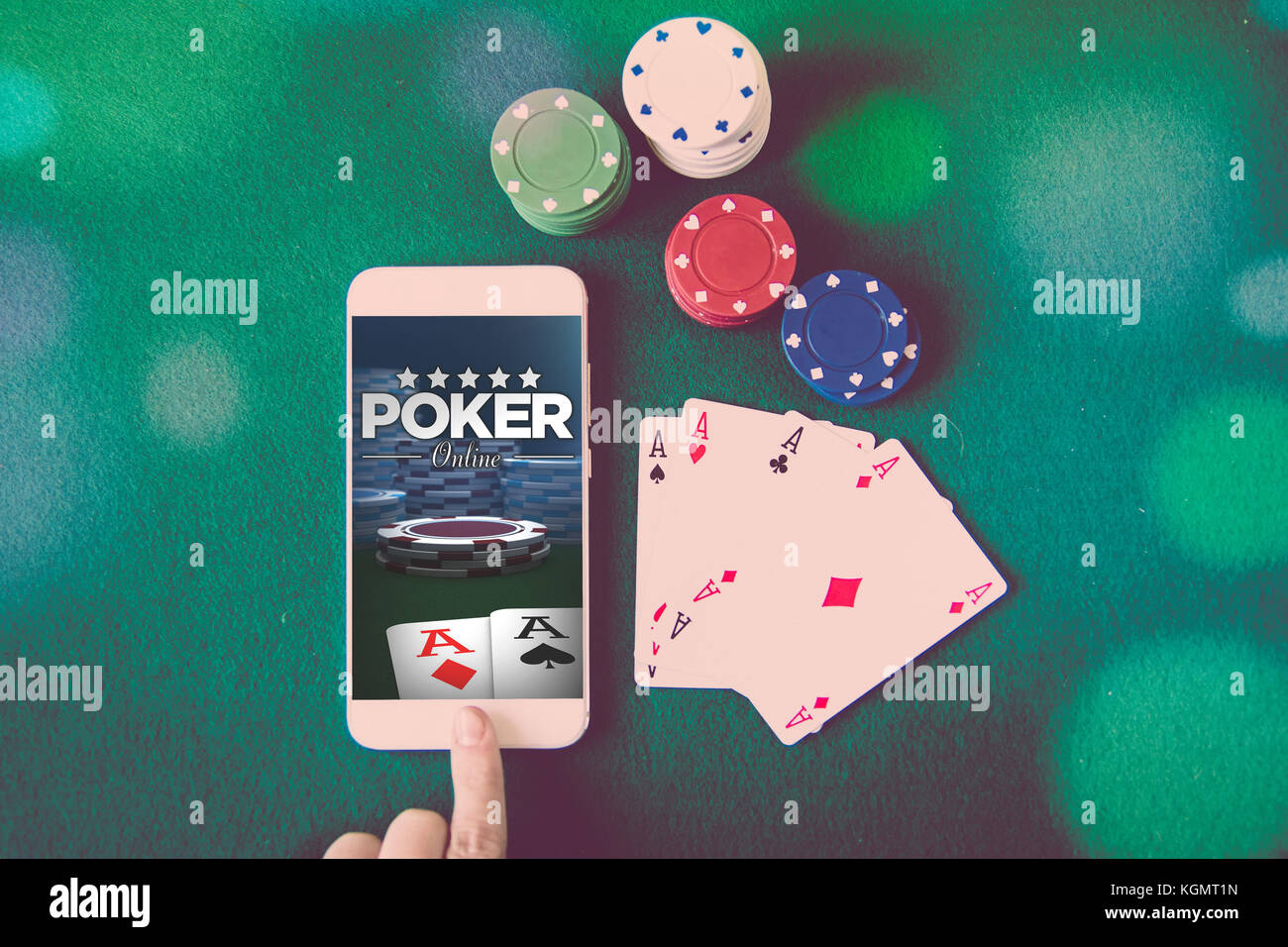 chips hand cards over card table with poker online smartphone Stock ...