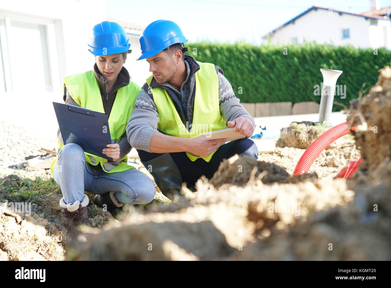 Construction site professional looking at digging in work Stock Photo ...