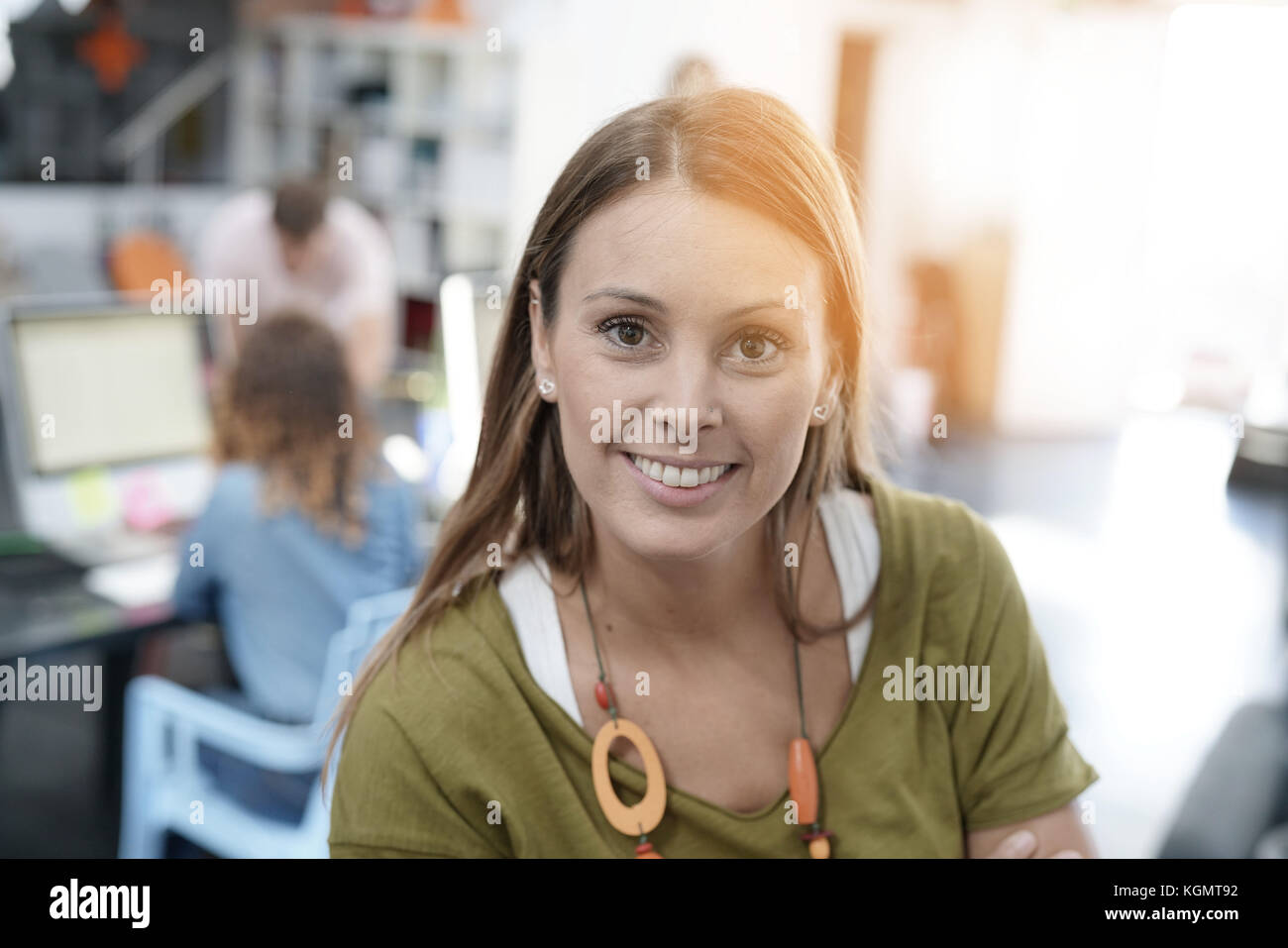 Portrait of woman in coworking office Stock Photo - Alamy