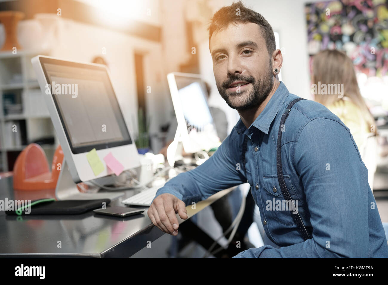 Startup entrepreneur sitting in office in front of desktop Stock Photo ...