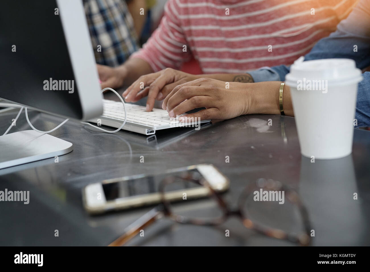 Closeup of hands typing on desktop keyboard Stock Photo - Alamy