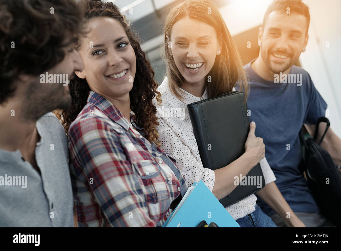 Group of students in business training standing in office Stock Photo ...