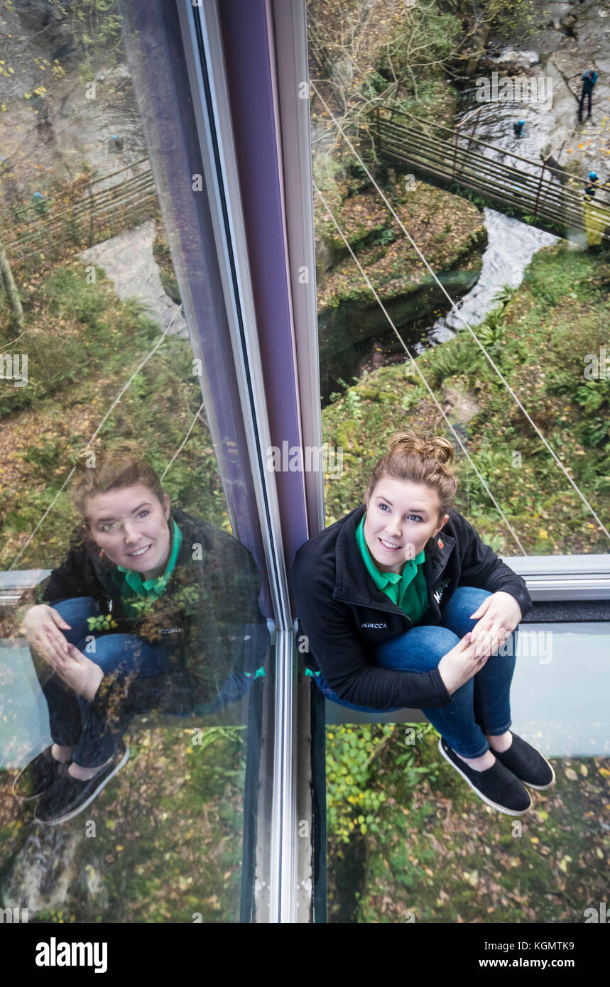 Rebecca Verity sits on the glass floor of a new cantilevered extension ...