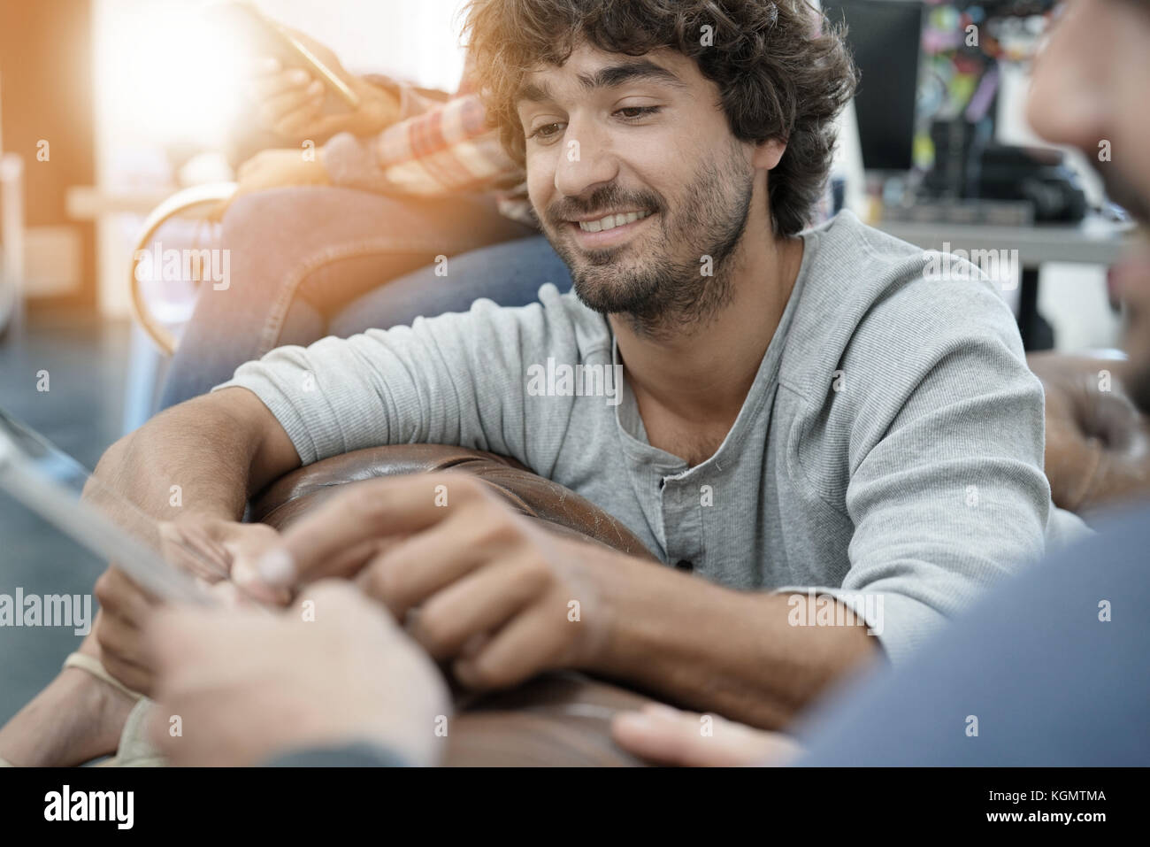 Men connected on digital tablet Stock Photo - Alamy