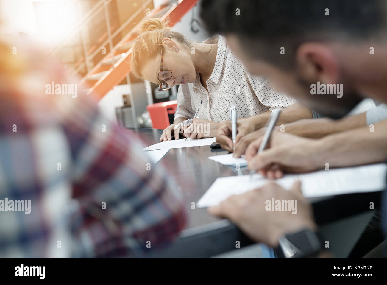 University students filling in application form Stock Photo - Alamy