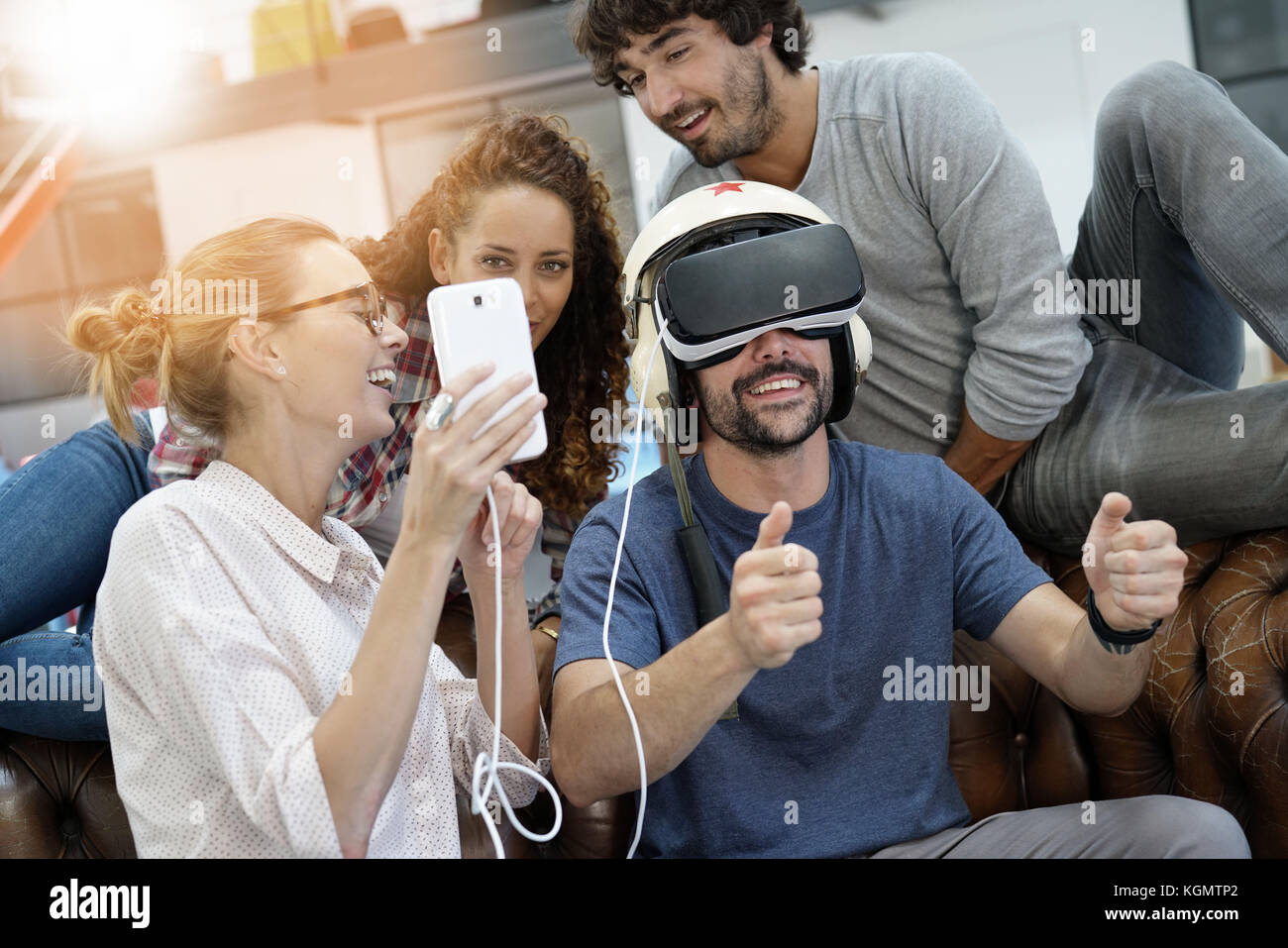 Group of friends playing together with virtual reality headset Stock ...