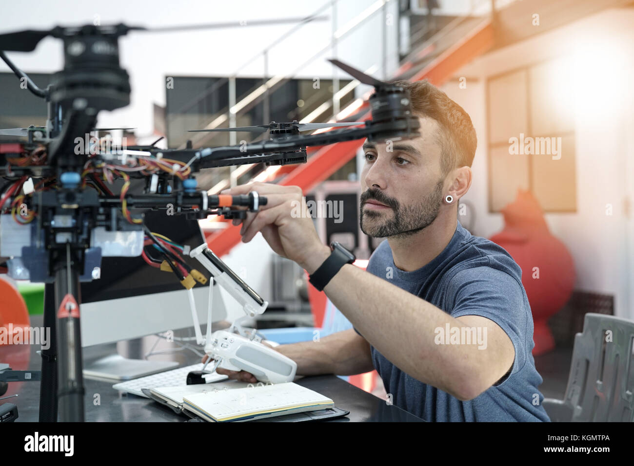 Engineer working on drone in lab Stock Photo - Alamy