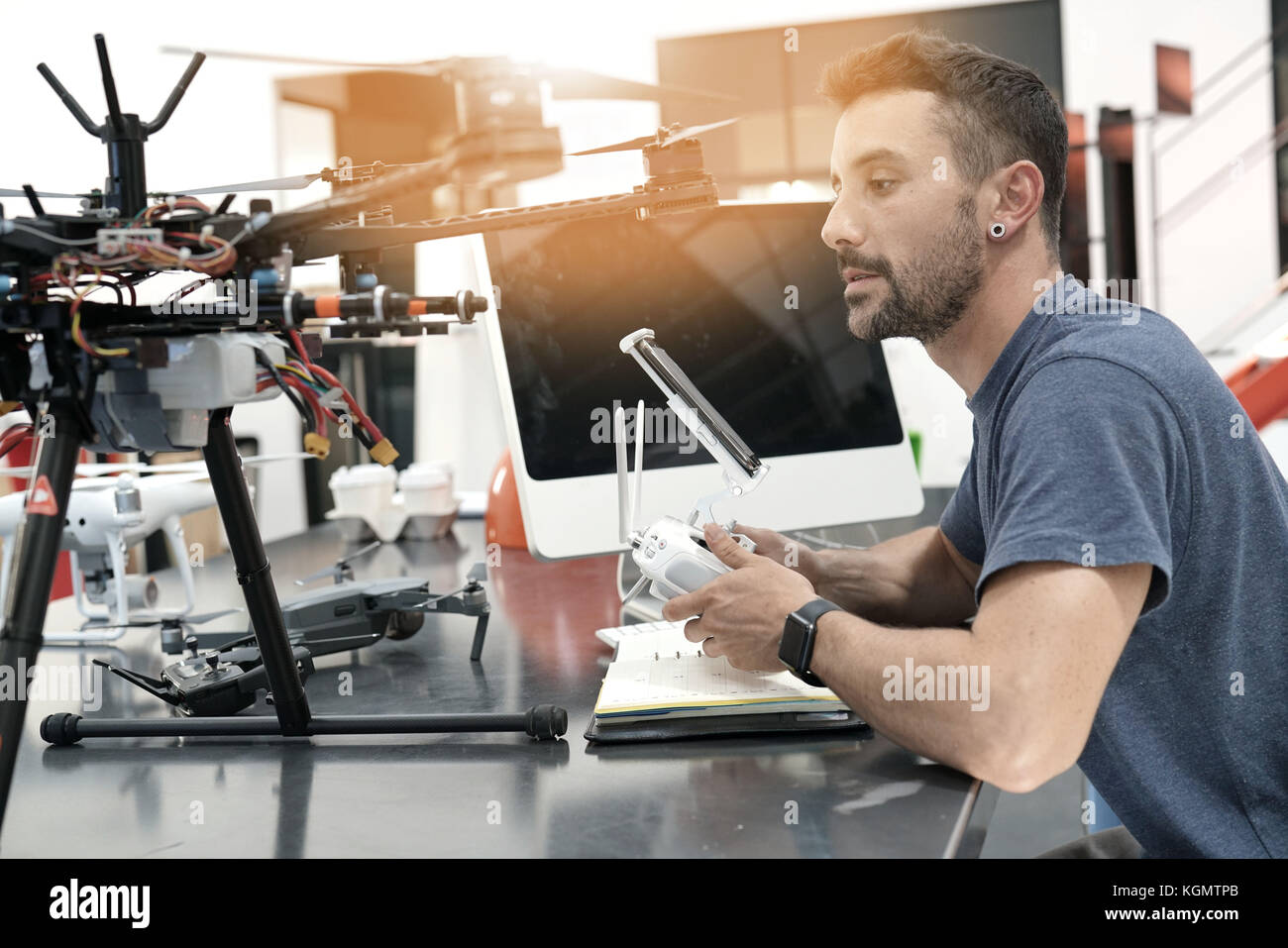 Engineer working on drone in lab Stock Photo - Alamy