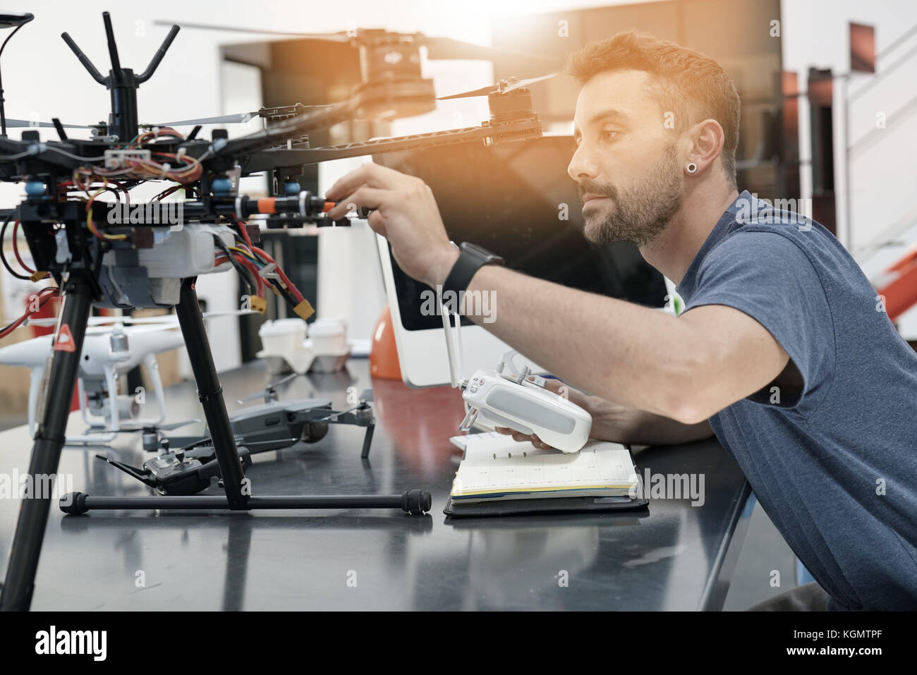 Engineer working on drone in lab Stock Photo - Alamy