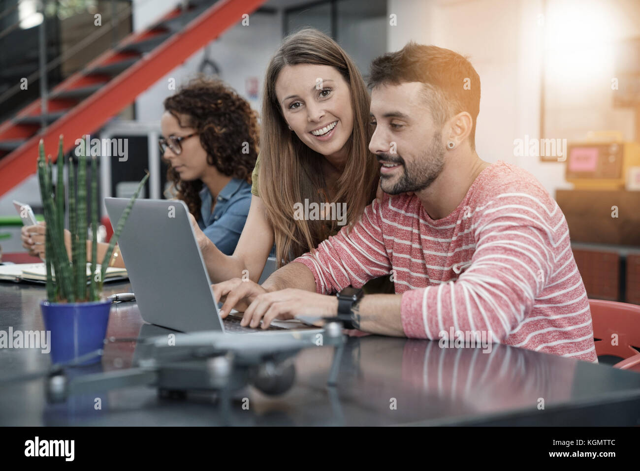 Start-up people working on laptop in office Stock Photo - Alamy