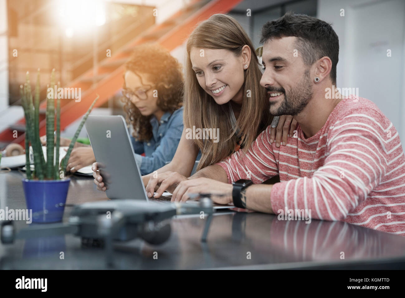 Start-up people working on laptop in office Stock Photo - Alamy