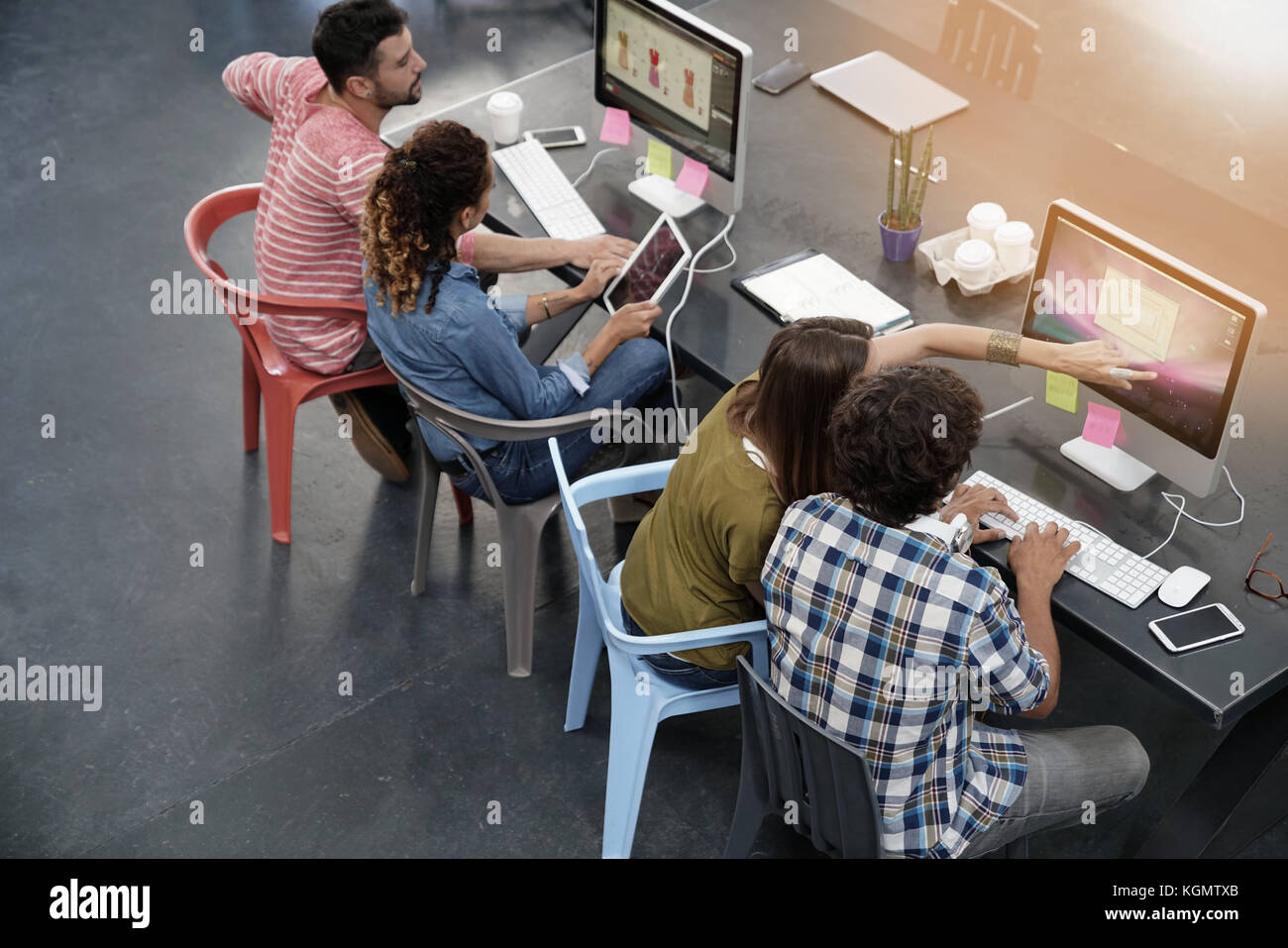 Upper view of start-up people working in open co-working office Stock ...