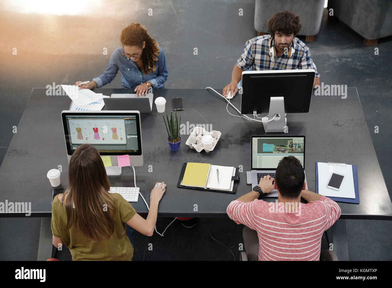 Upper view of start-up people working in open co-working office Stock ...