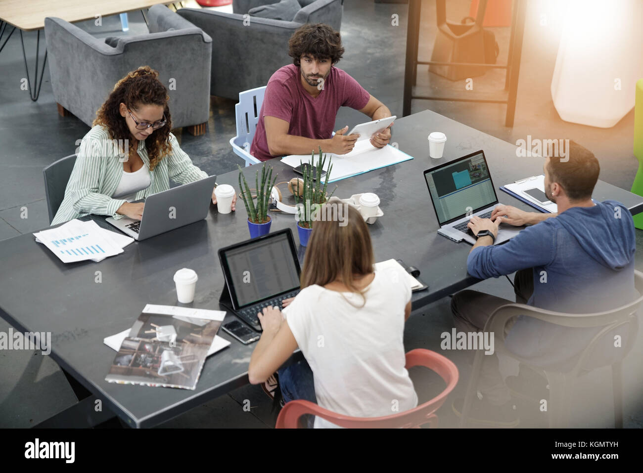 Upper view of start-up people working in open co-working office Stock ...