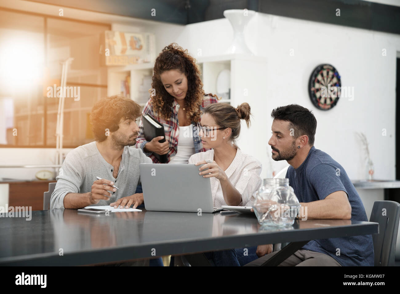 Young people meeting with laptop computer Stock Photo - Alamy