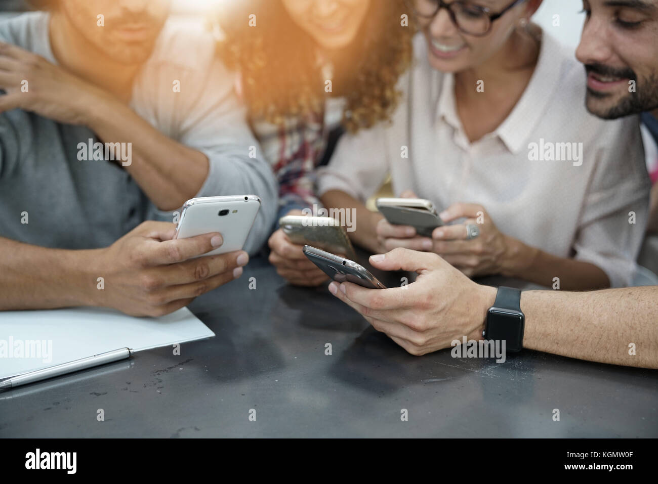 Young people having fun using smartphones Stock Photo - Alamy