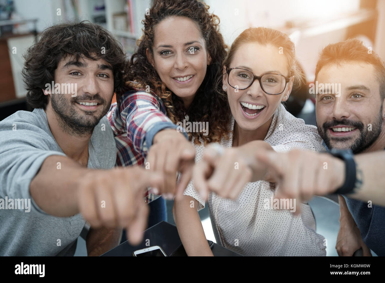 Group laughing pointing hi-res stock photography and images - Alamy
