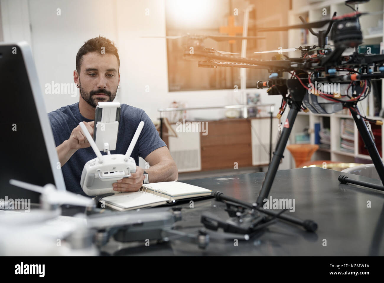 Engineer working on drone in office Stock Photo - Alamy