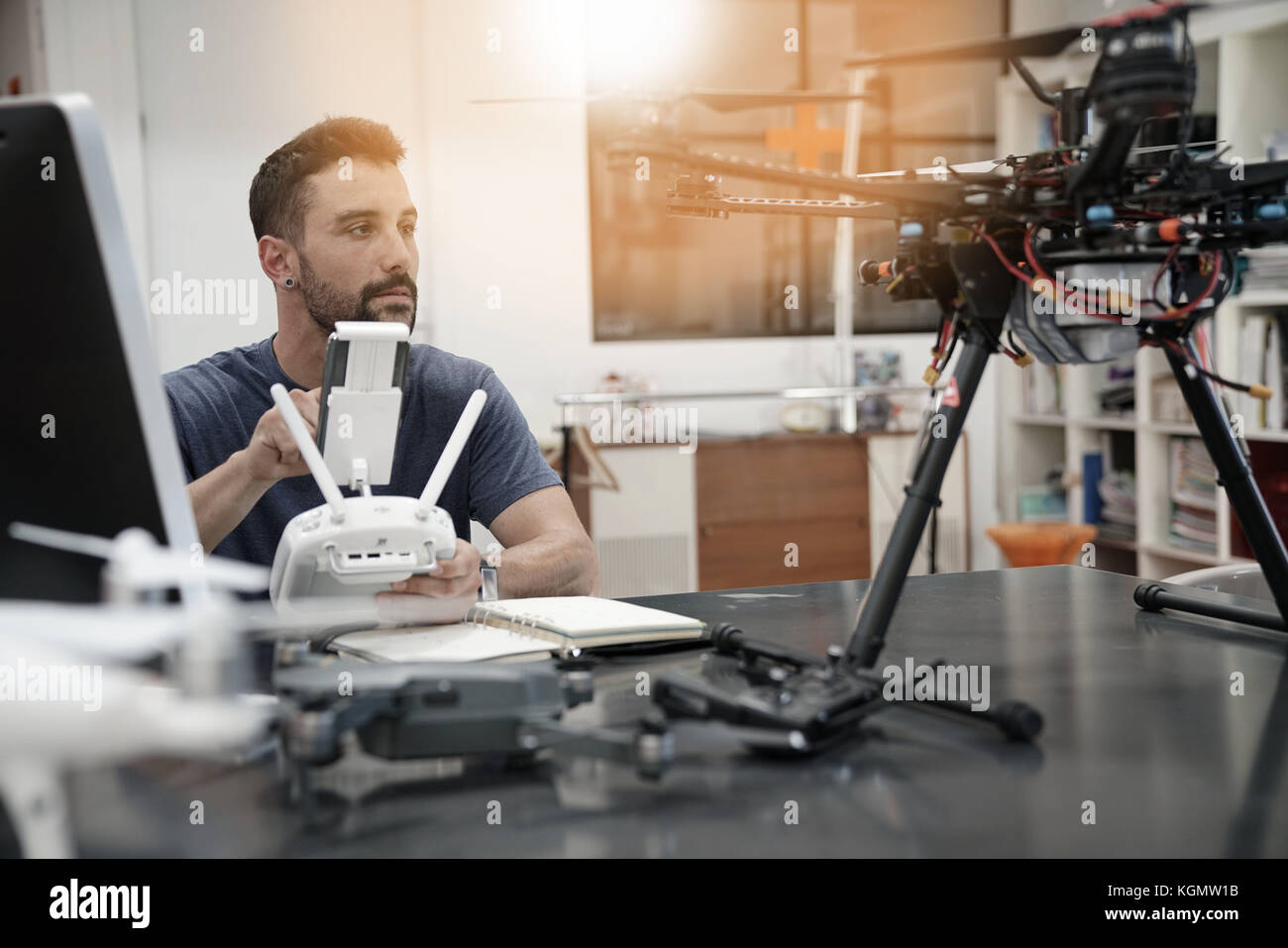 Engineer working on drone in office Stock Photo - Alamy