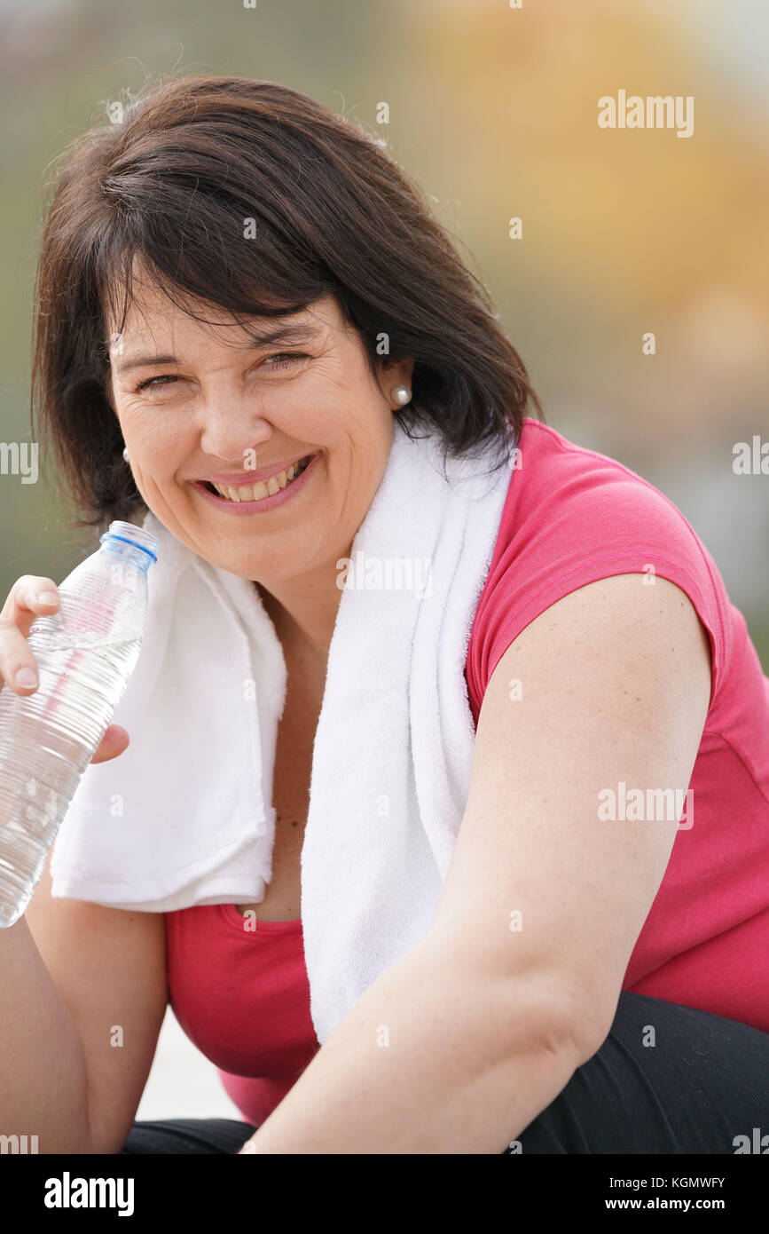 Portrait of overweight woman in fitness outfit Stock Photo - Alamy
