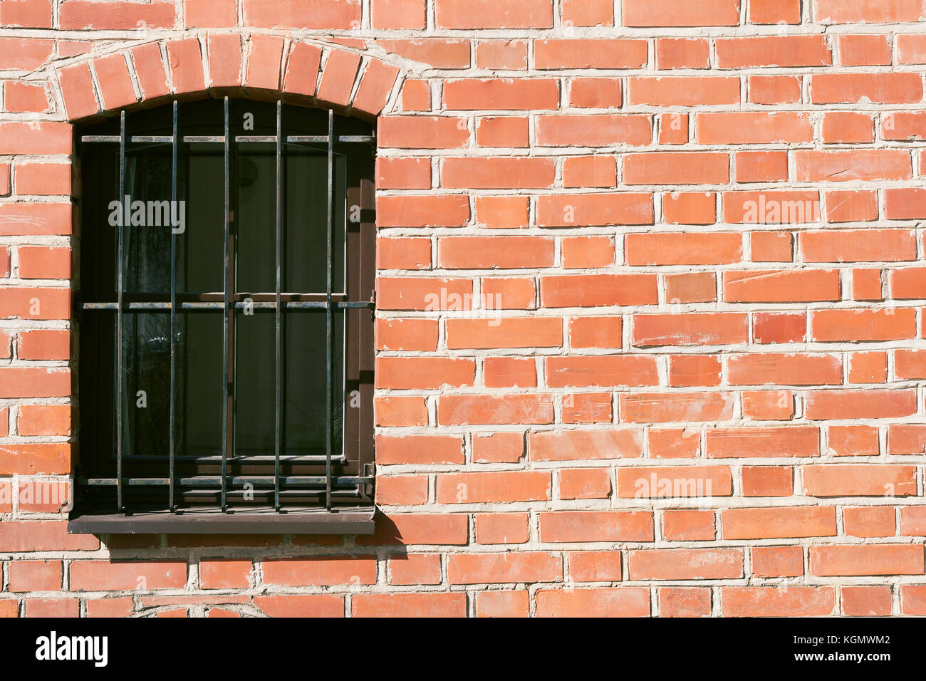Red brick wall with a window Stock Photo - Alamy