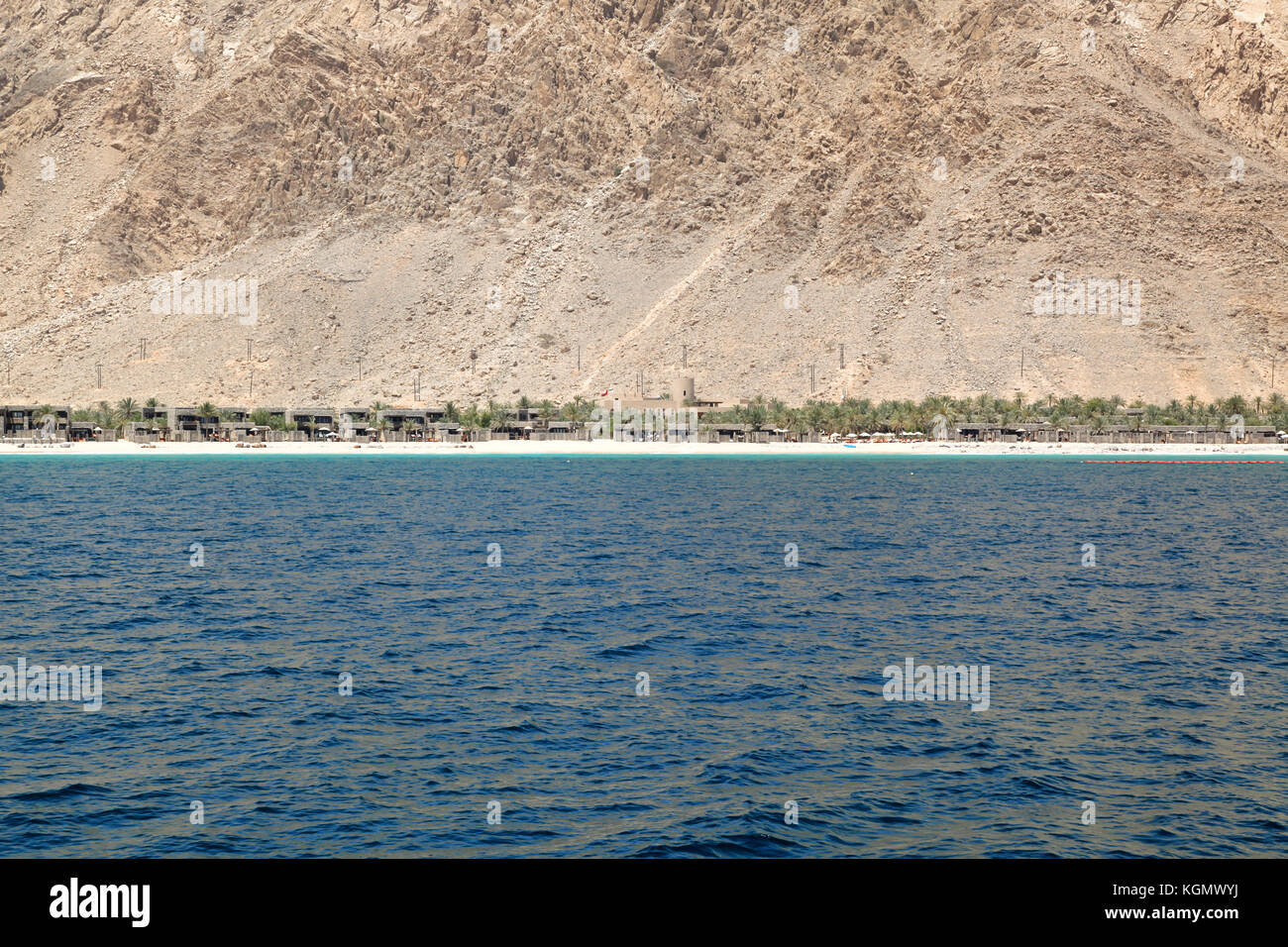 Holiday resort nestling at the base of the Musandam Mountain range ...