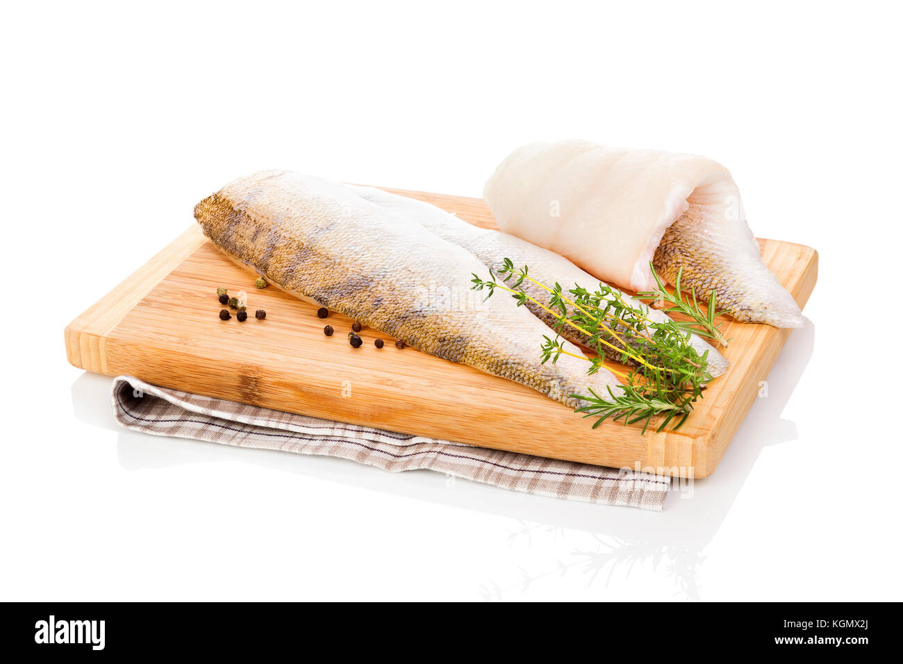 Fillet fish slices on wooden chopping board isolated on white ...