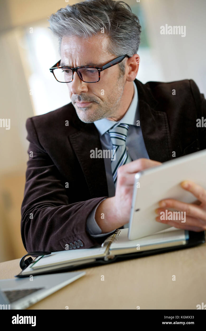 Attorney working in office on laptop Stock Photo - Alamy