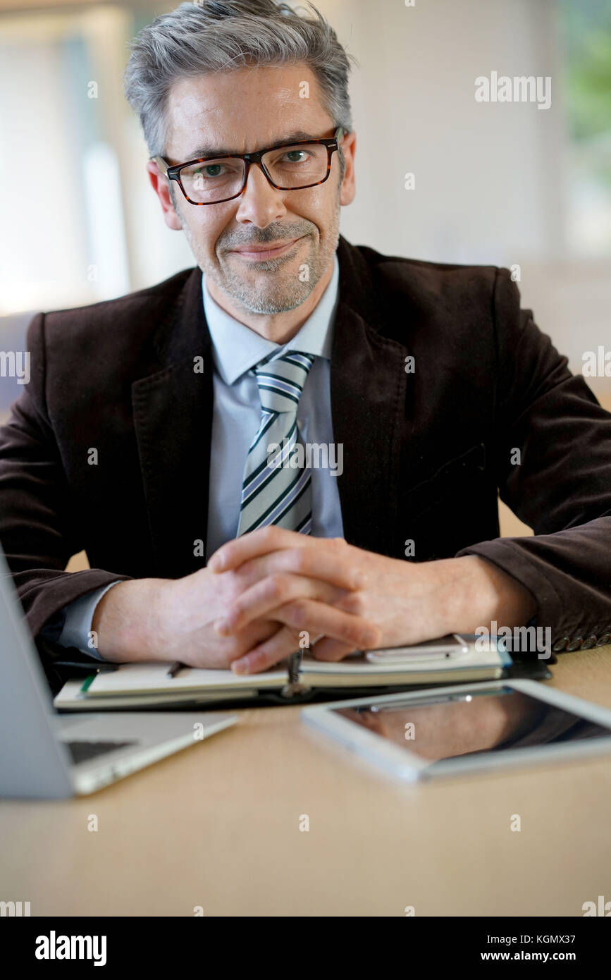 Attorney working in office on laptop Stock Photo - Alamy